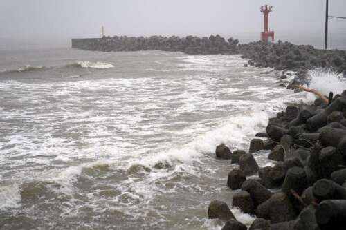Two tropical storms pound Japan, causing flooding and landslides - The ...